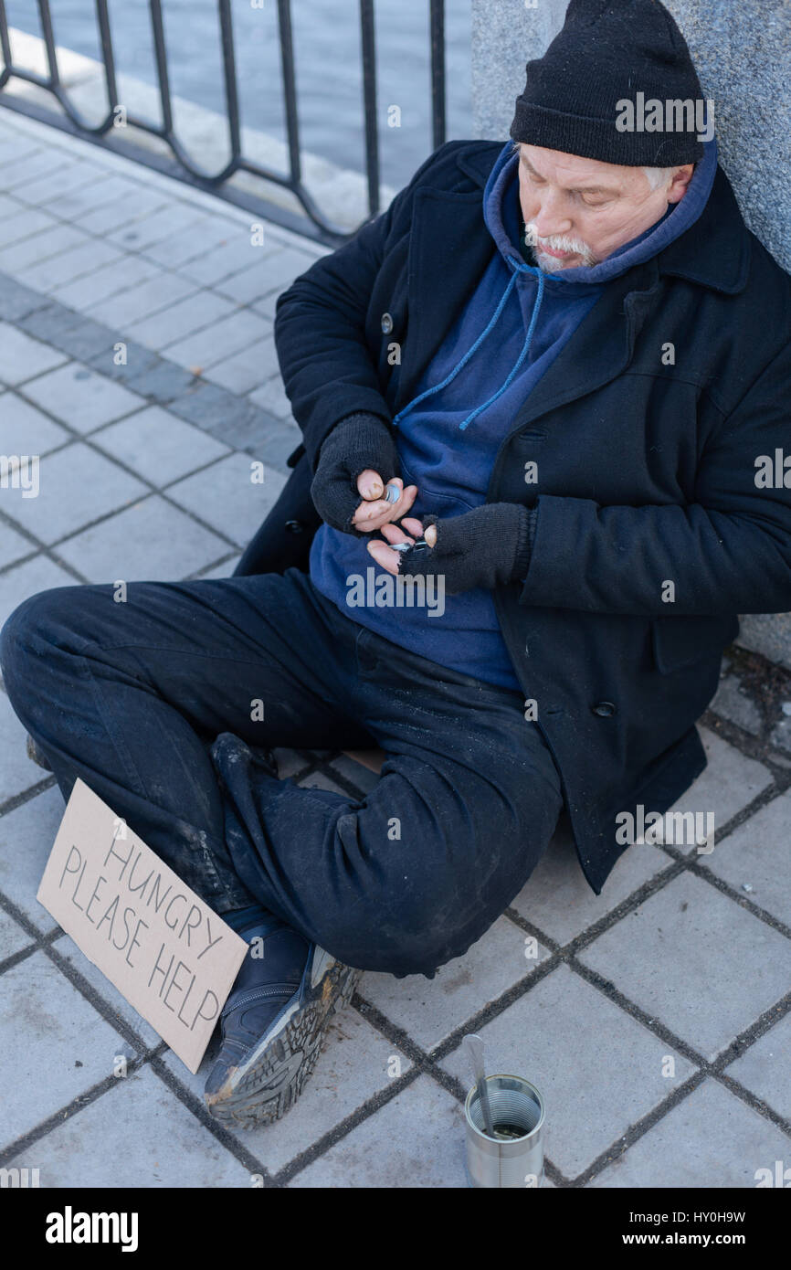 Full length photo of homeless asking for money Stock Photo - Alamy