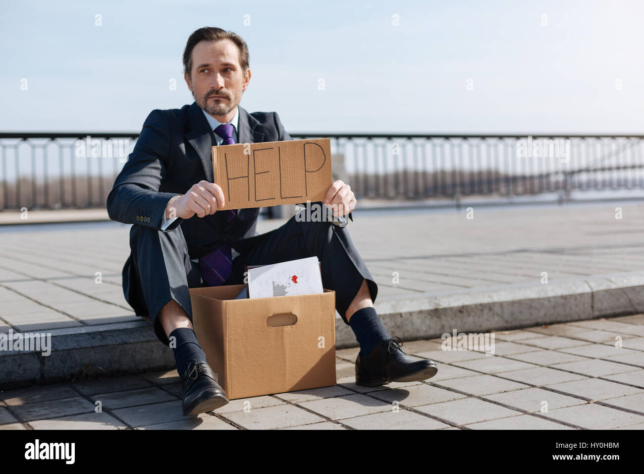 Jobless male person asking for help Stock Photo - Alamy