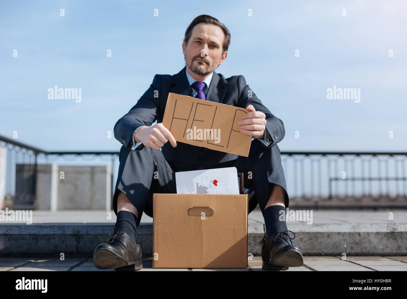 Confident worker asking for help Stock Photo - Alamy