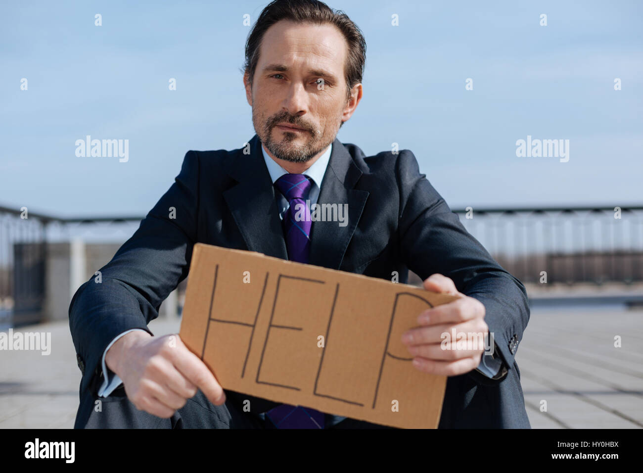 Portrait of sad man looking straight on camera Stock Photo - Alamy