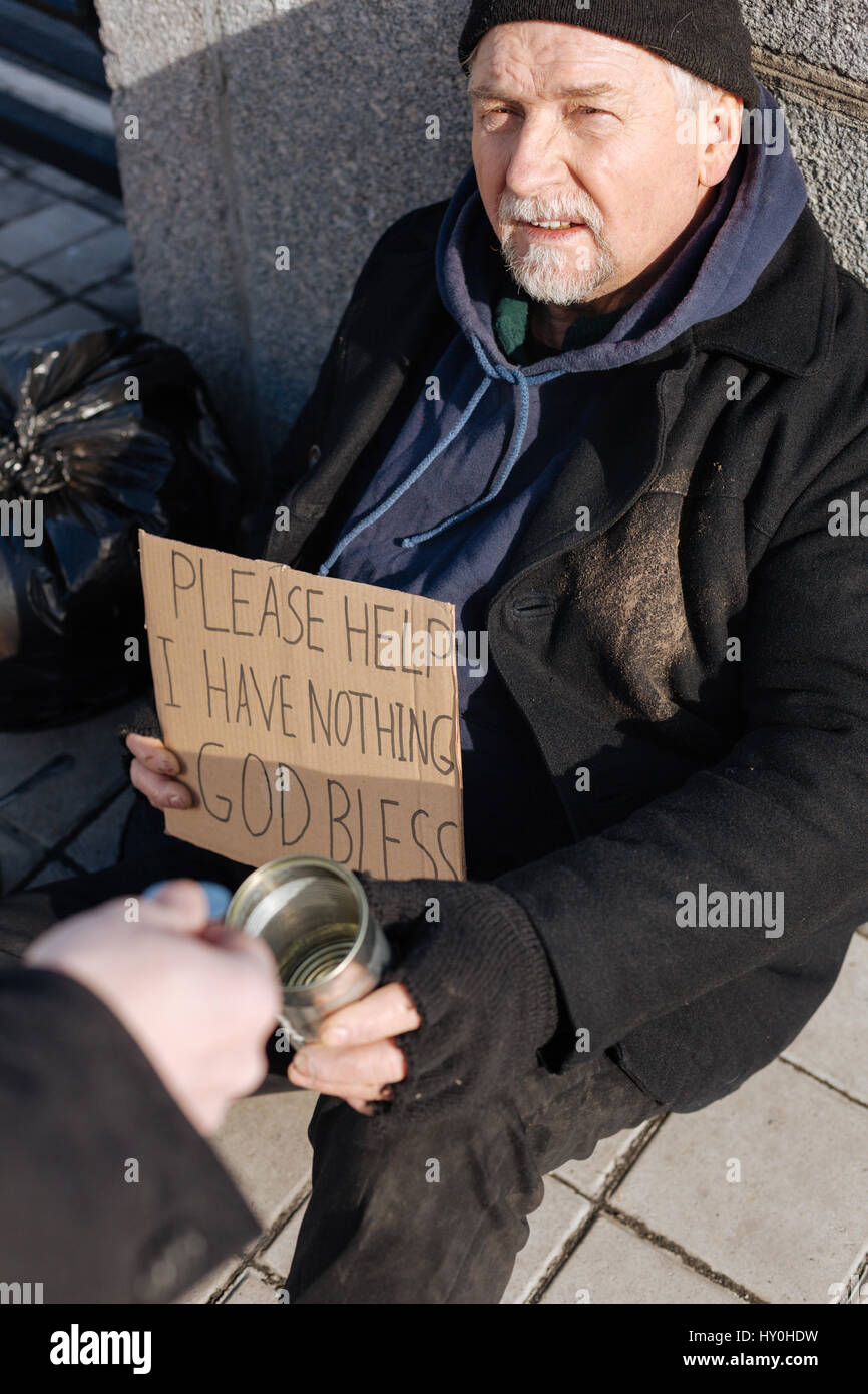 Serious poor man wearing untidy clothes Stock Photo - Alamy