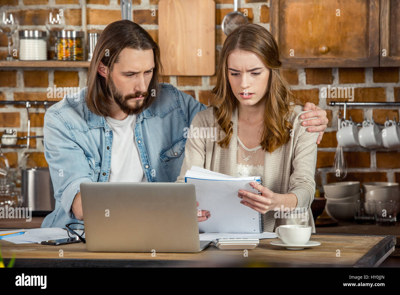 Home hug couple documents hi-res stock photography and images - Alamy