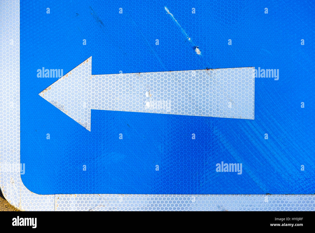 Left arrow on road sign. Close-up Stock Photo - Alamy