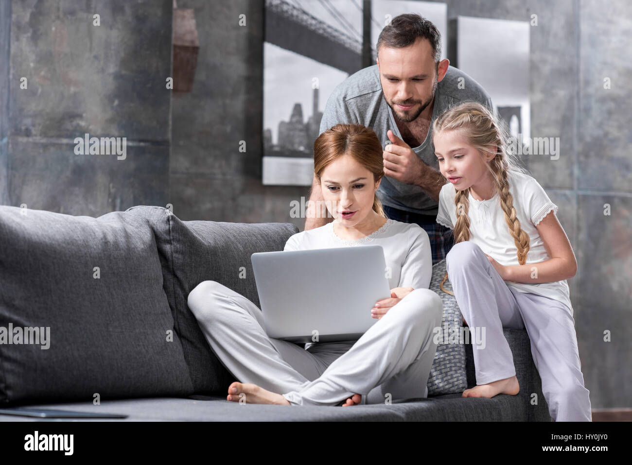 Mother father young daughter pensive hi-res stock photography and ...