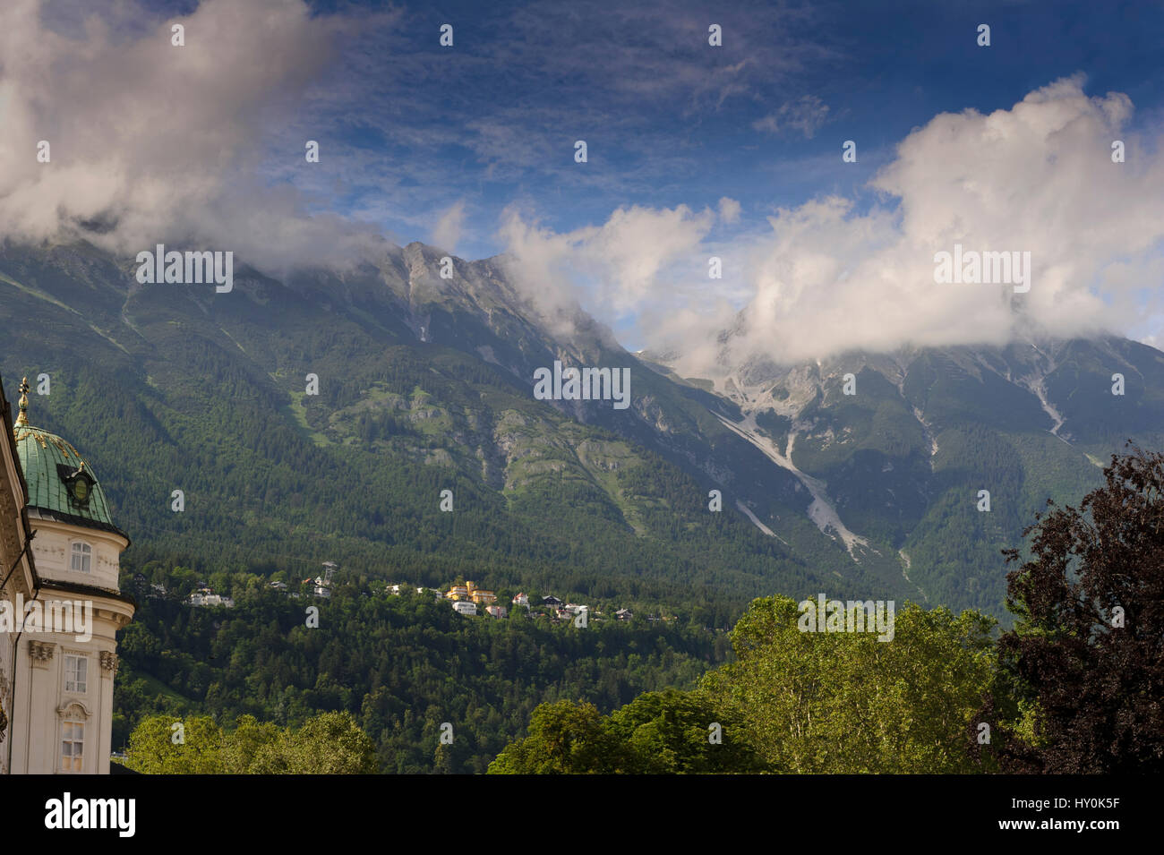 A panoramic view of the mountains, the river and a funicular bridge in ...