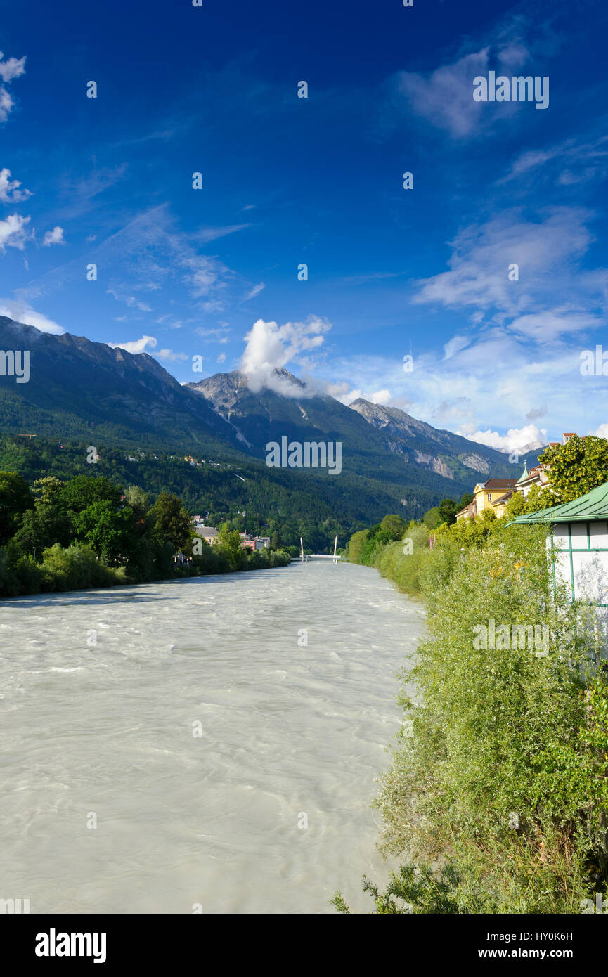 A panoramic view of the mountains, the river and a funicular bridge in ...