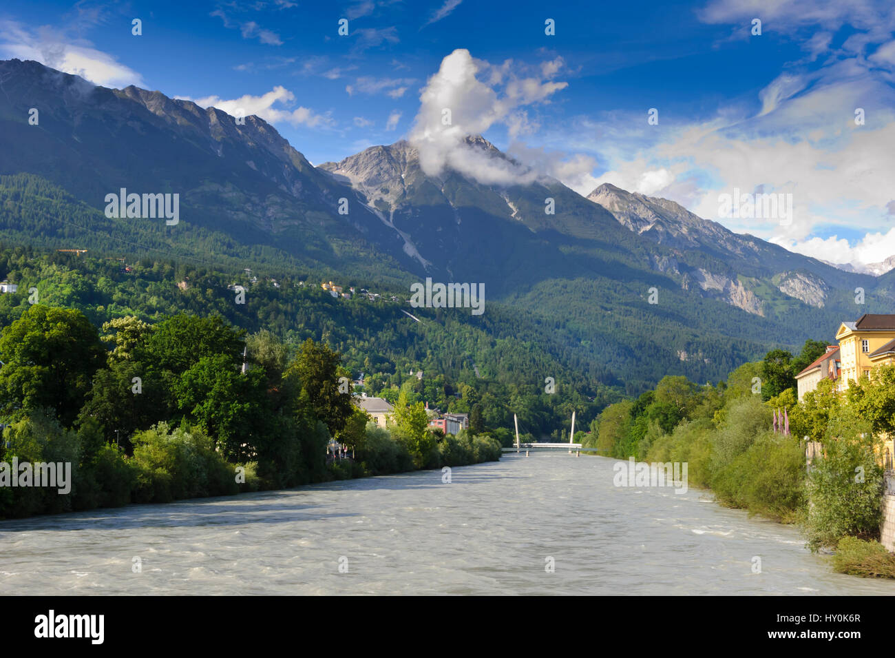A panoramic view of the mountains, the river and a funicular bridge in ...