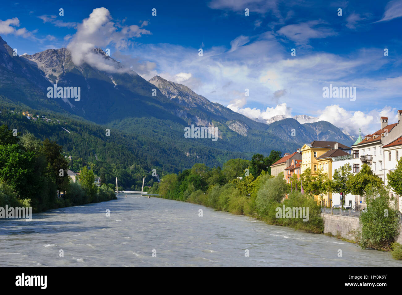 A panoramic view of the mountains, the river and a funicular bridge in ...