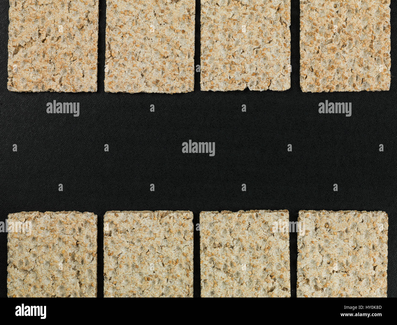 Crispy Dry Rye Crackers On A Black Background Stock Photo - Alamy