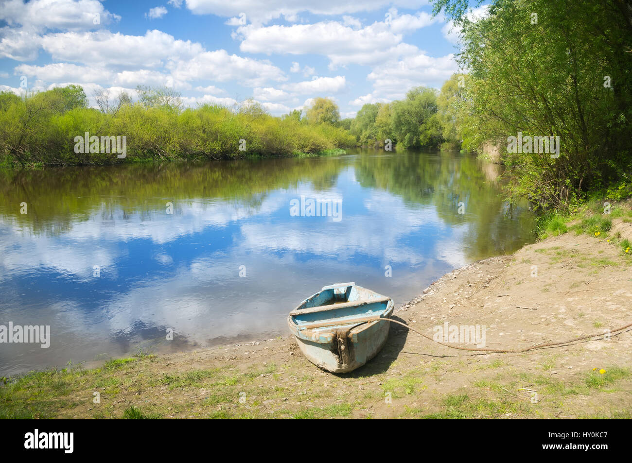 summer landscape. Wooden boat on the river bank.wooden boat on a river ...