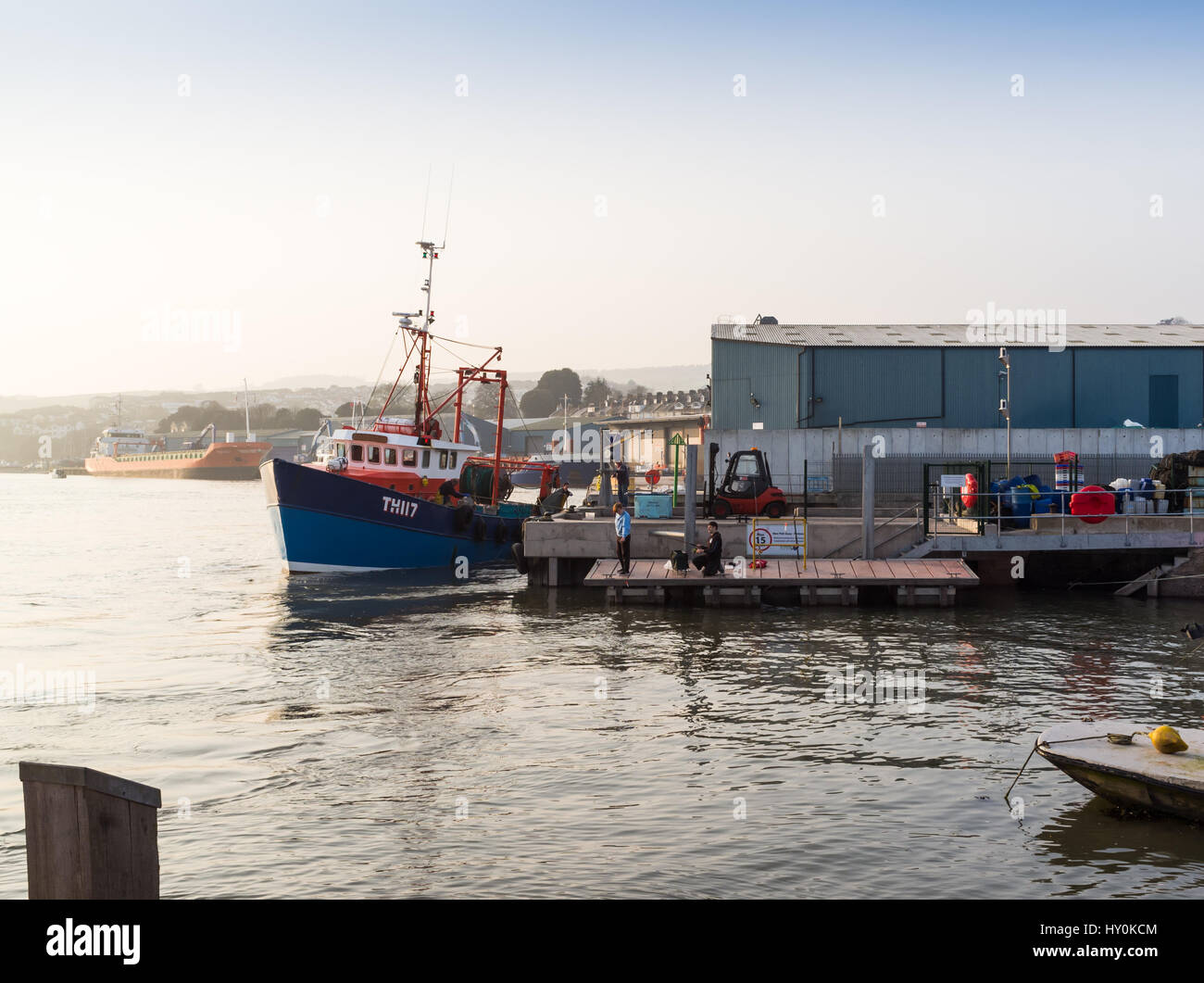 A Teignmouth trawler, docking to unload its catch of fish on the fish ...