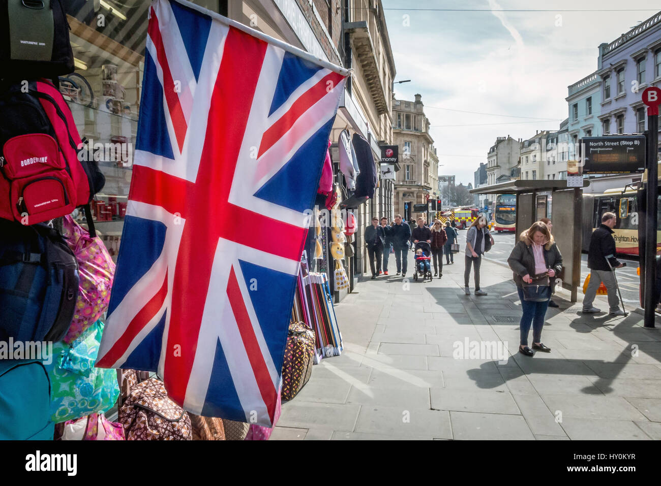 The Union flag still flying in a British High Street Stock Photo - Alamy