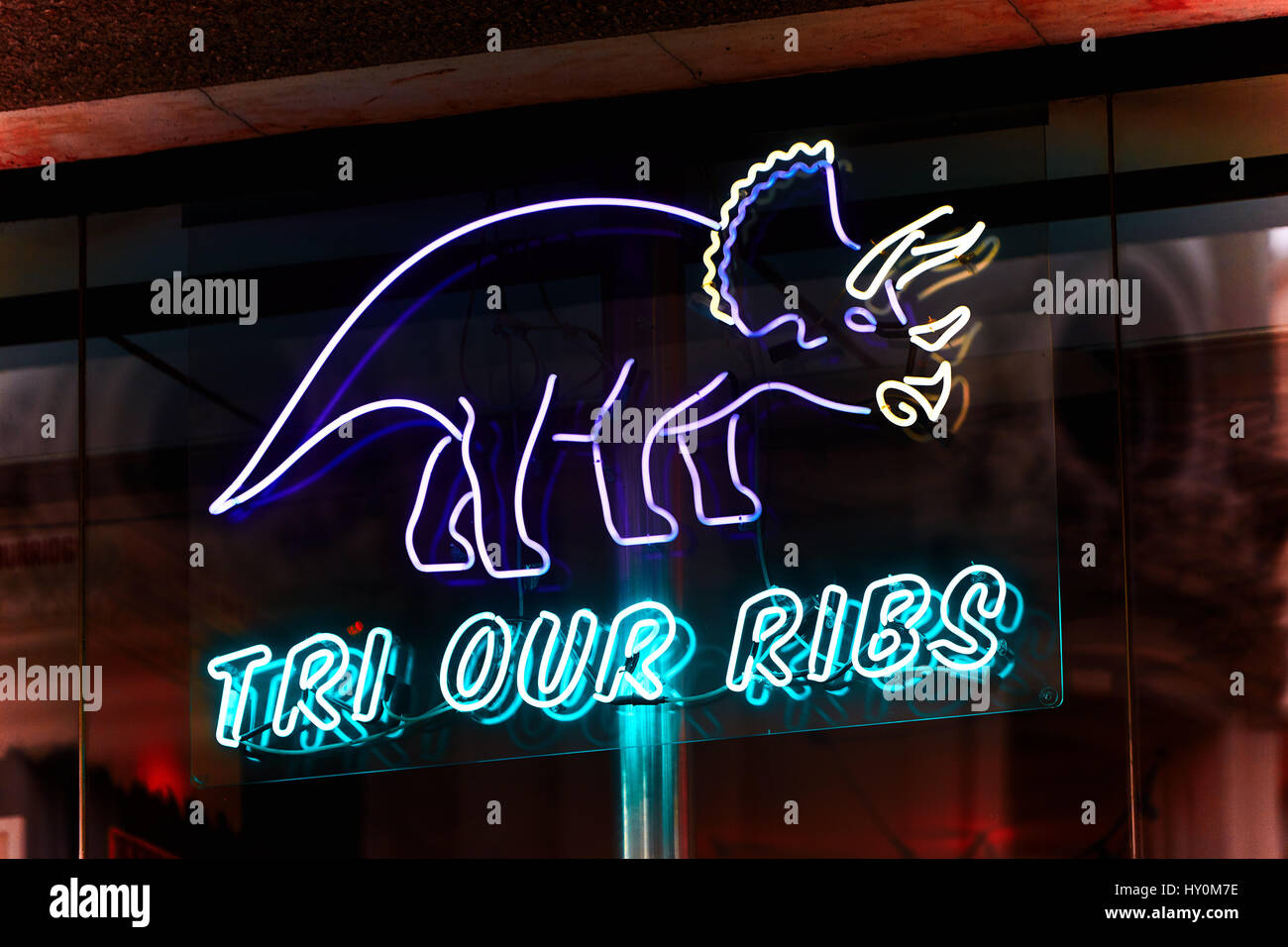 Dinosaur neon triceratops hi-res stock photography and images - Alamy