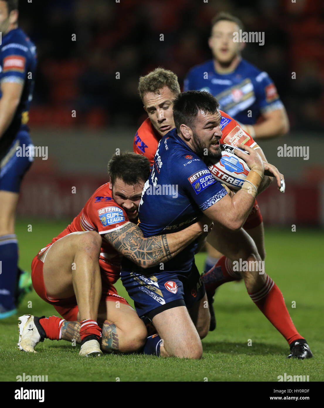 Salford Red Devils' George Griffin (left) tackles St Helens' Luke ...