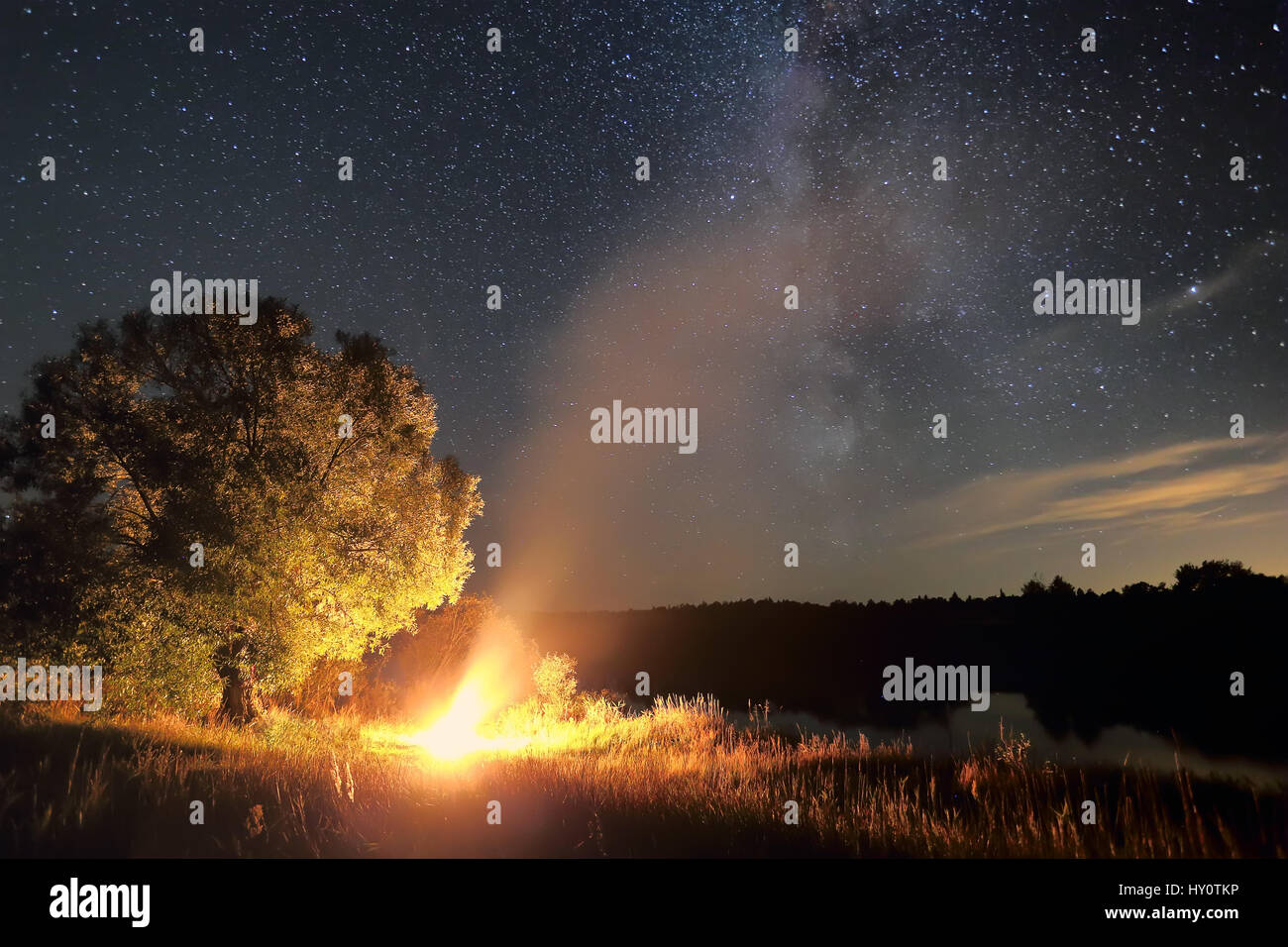 Night travel background. Bonfire at night under starry sky. Milky way ...