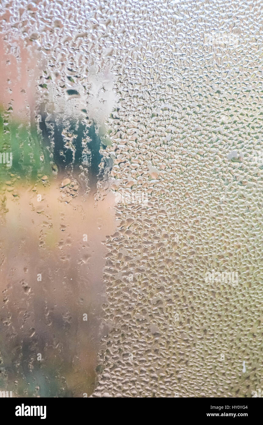 Rain water droplets on window macro closeup Stock Photo - Alamy