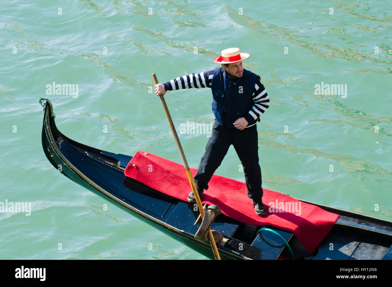 gondolier on gondola in Venice italy Stock Photo - Alamy