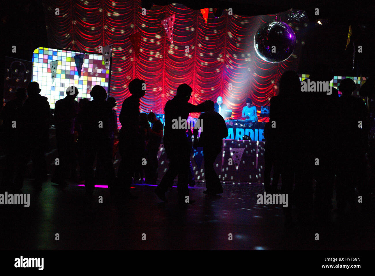 People dancing under the disco ball at a silent disco, SWN festival ...
