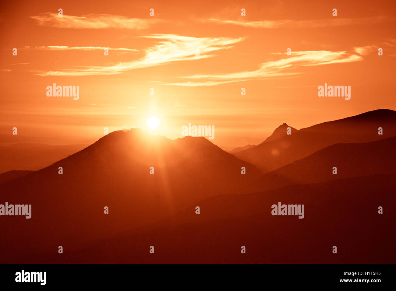 A beautiful, colorful, abstract mountain landscape with sun in a red ...