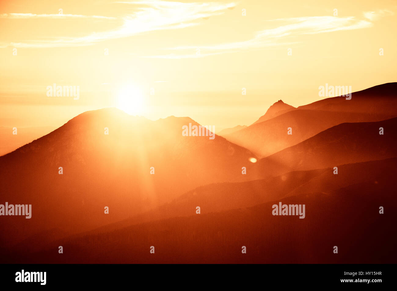 A beautiful, colorful, abstract mountain landscape with sun in a red ...