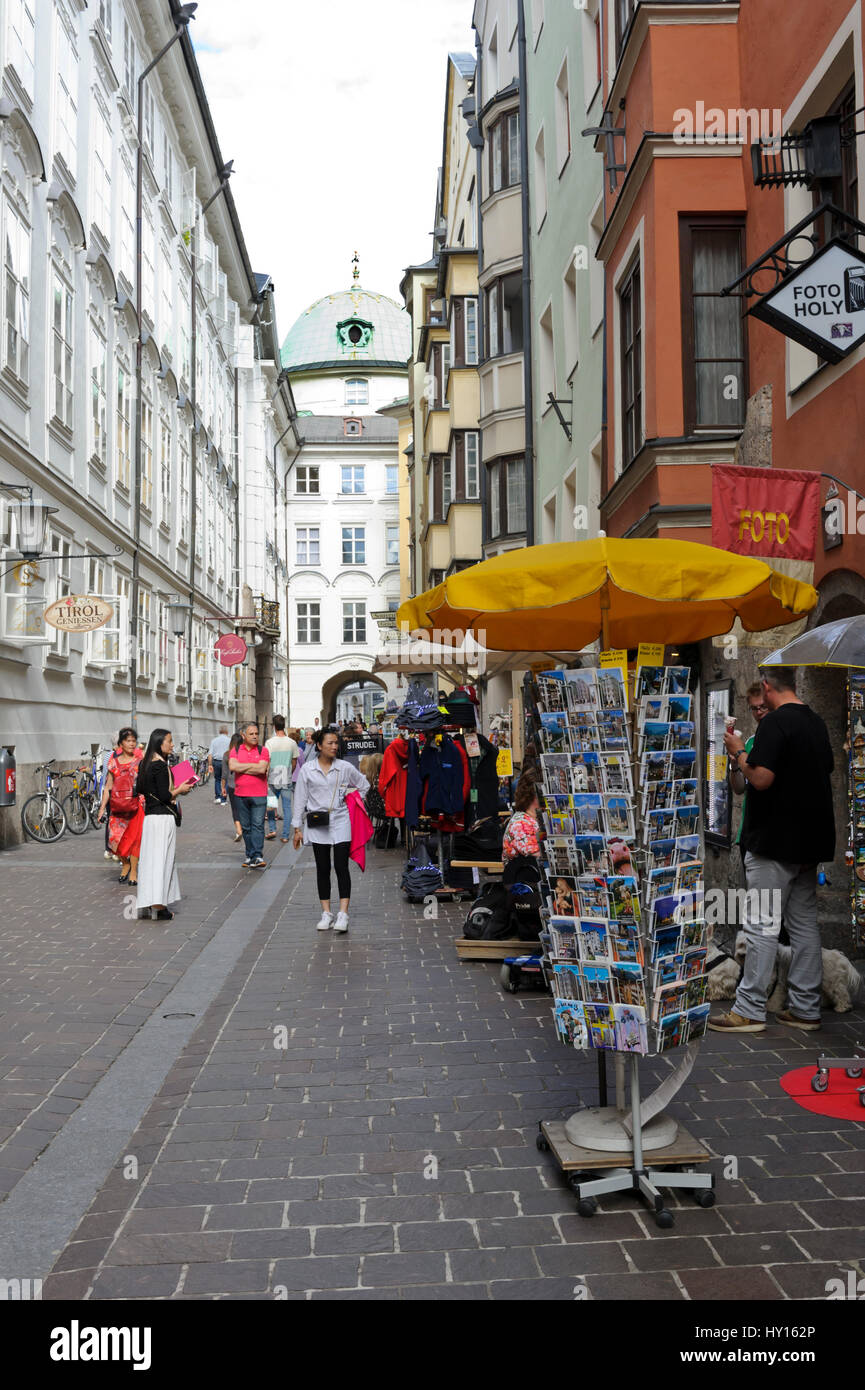 A narrow street with rows of shops, Innsbruck, Austria Stock Photo - Alamy