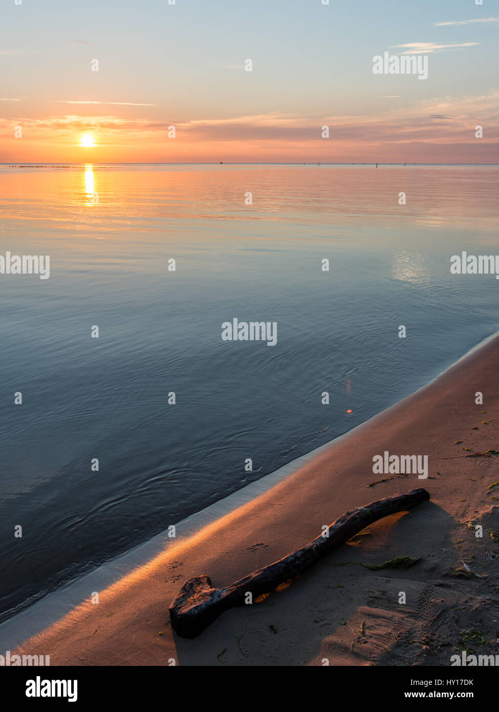 Beautiful sunset over the sea with clouds and reflections Stock Photo ...