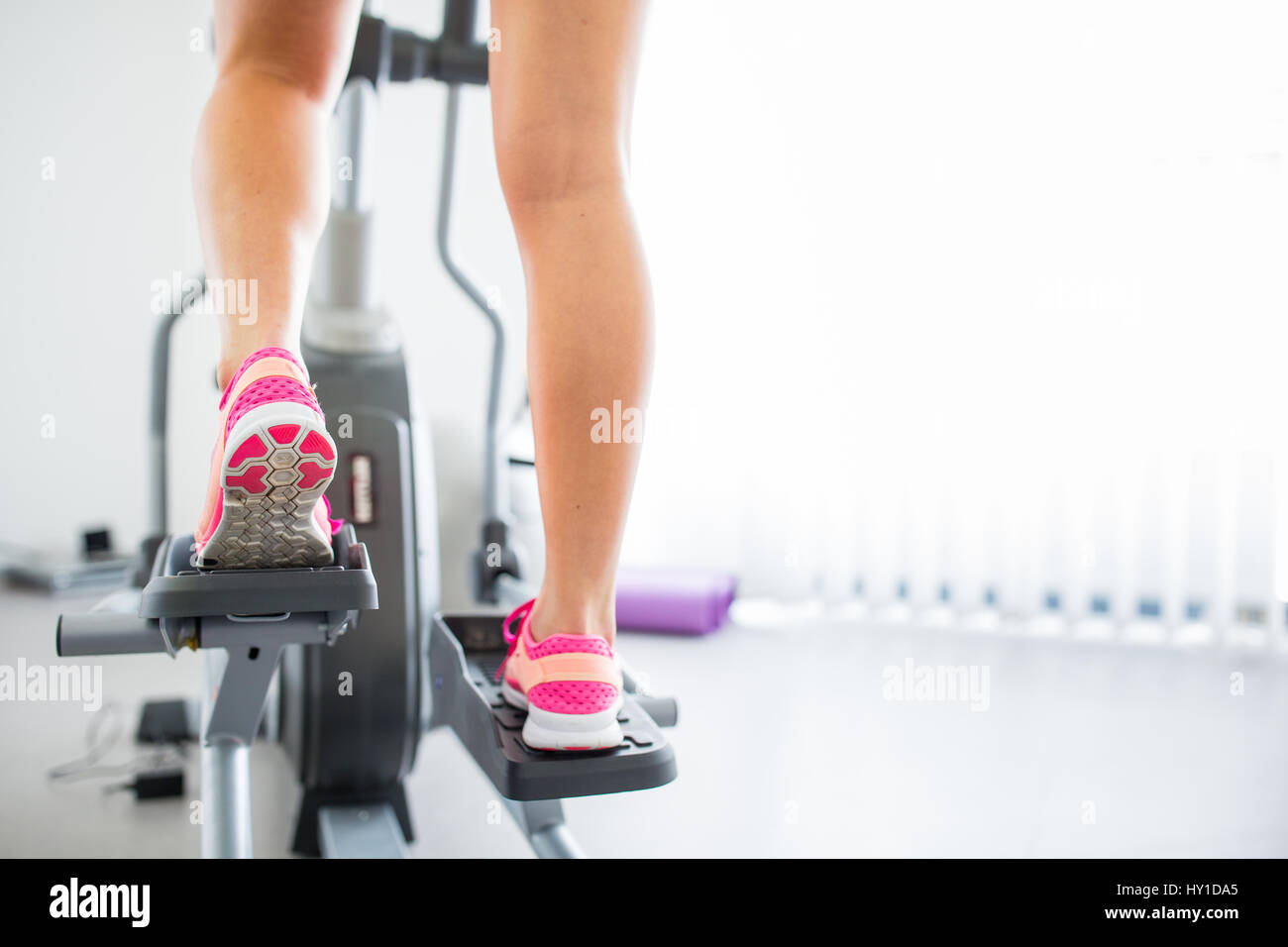 Young woman's muscular legs on stepper/treadmill, closeup Stock Photo ...