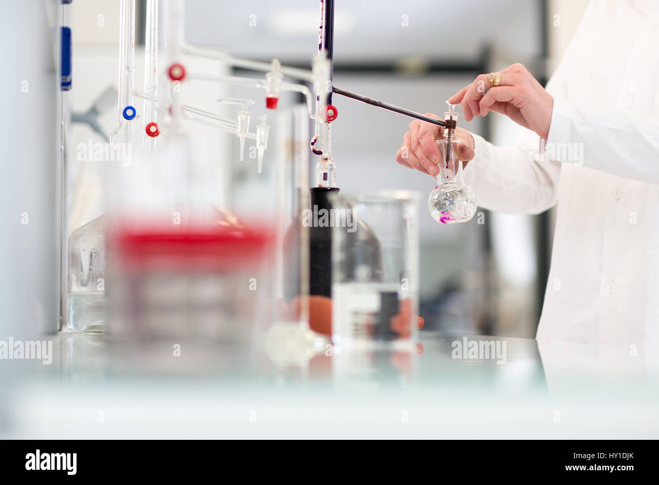 Lab worker's hands while at work at a research center in a lab ...
