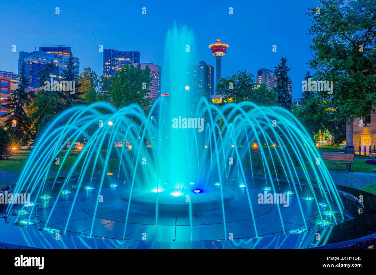 Illuminated fountain with the Calgary Tower in the distance, Central ...