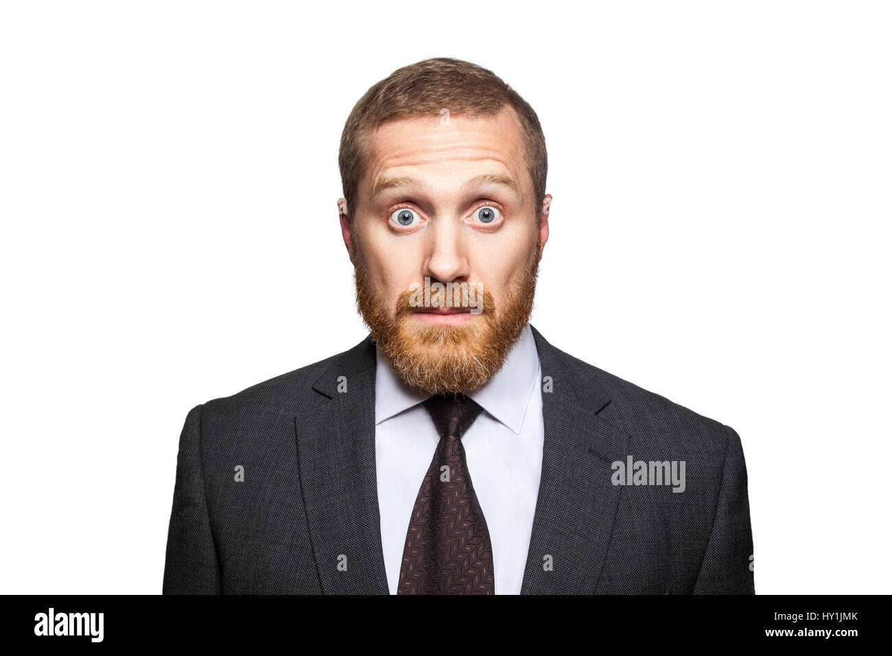 Shocked surprised businessman looking at camera with big eyes. isolated ...