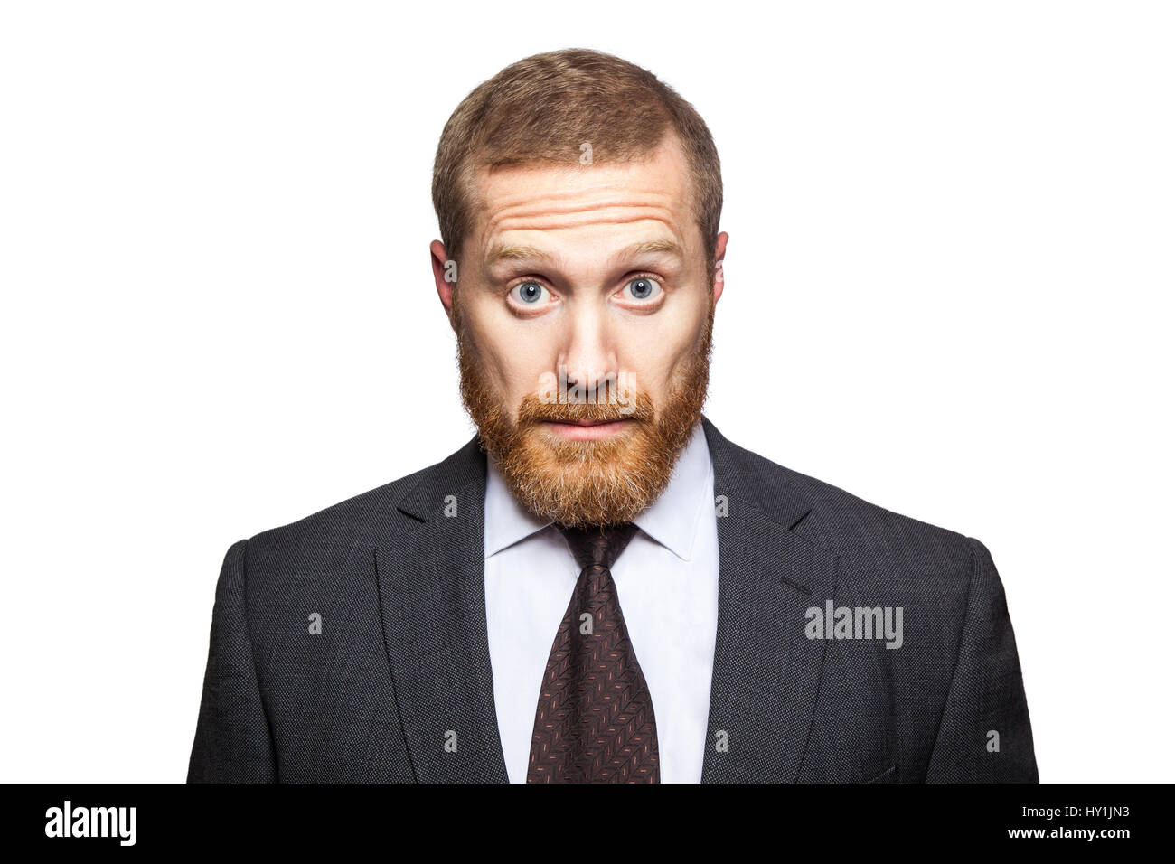Shocked surprised businessman looking at camera with big eyes. isolated ...