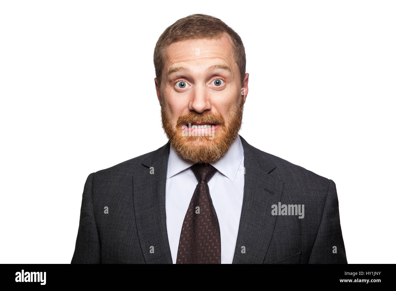 Shocked surprised businessman looking at camera with big eyes. isolated ...