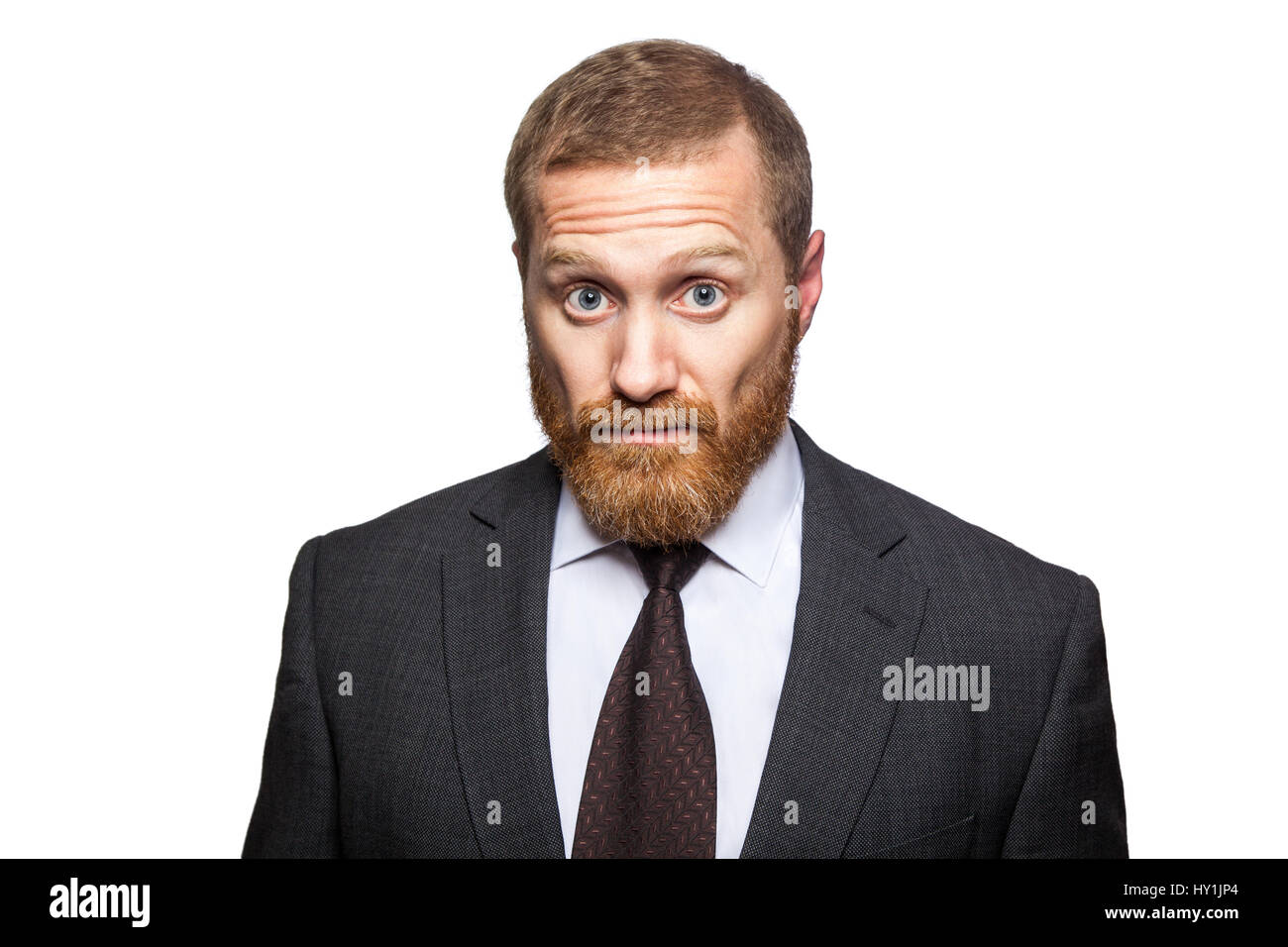 Shocked surprised businessman looking at camera with big eyes. isolated ...