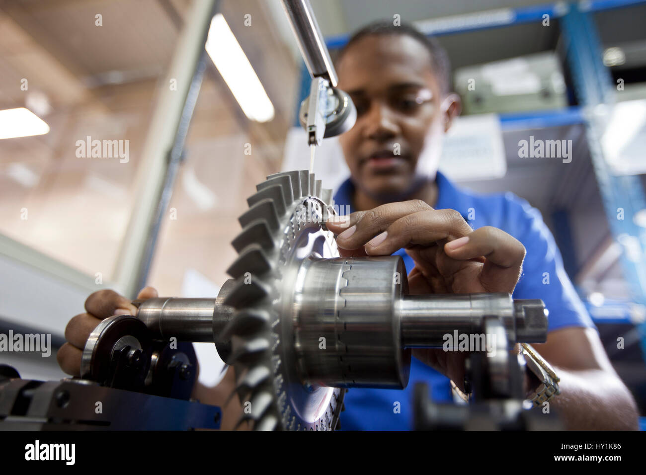 Young black factory worker, aerospace industry, machining and balancing ...