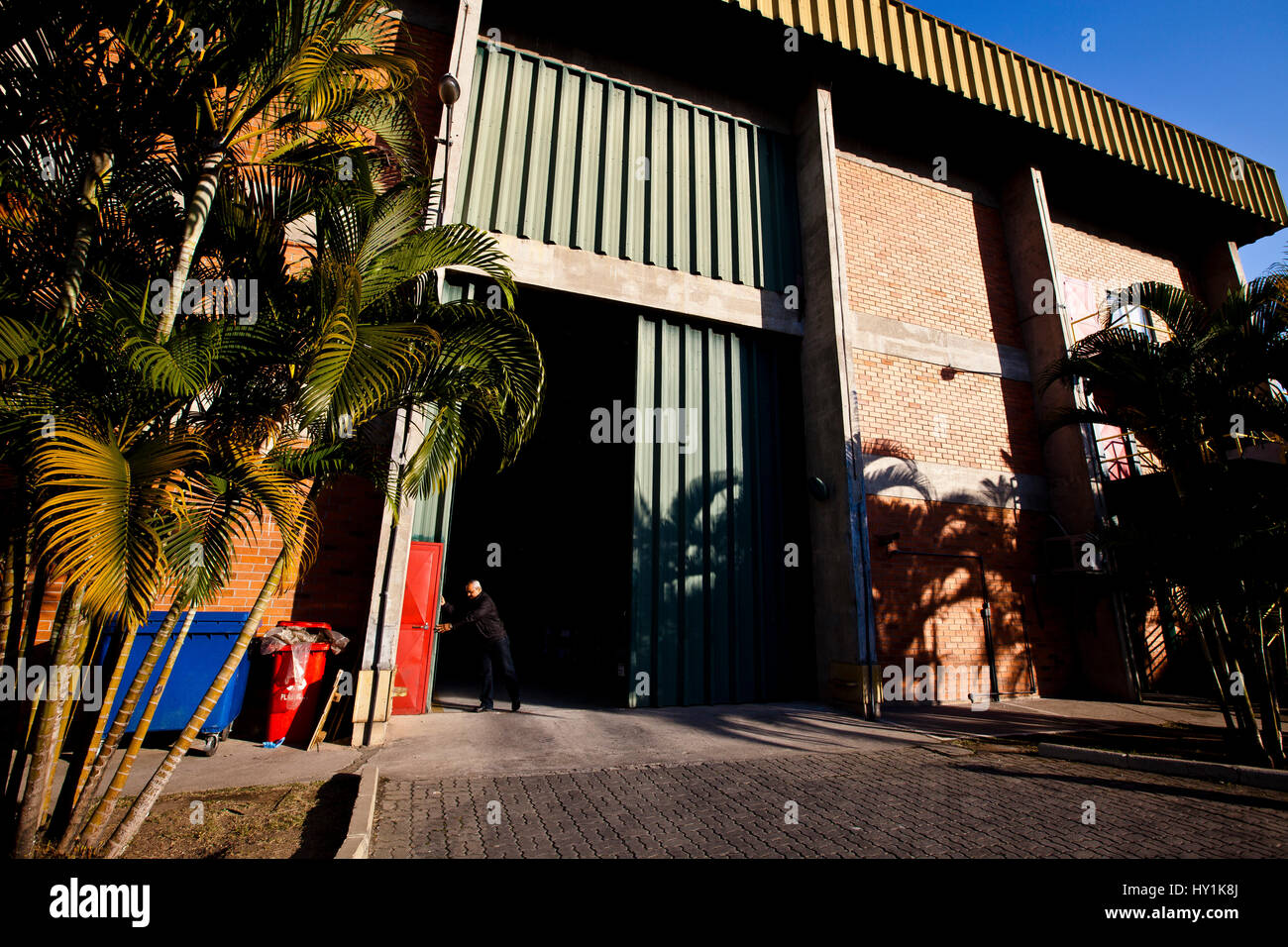 Factory main entrance, front view of industrial building, employee ...