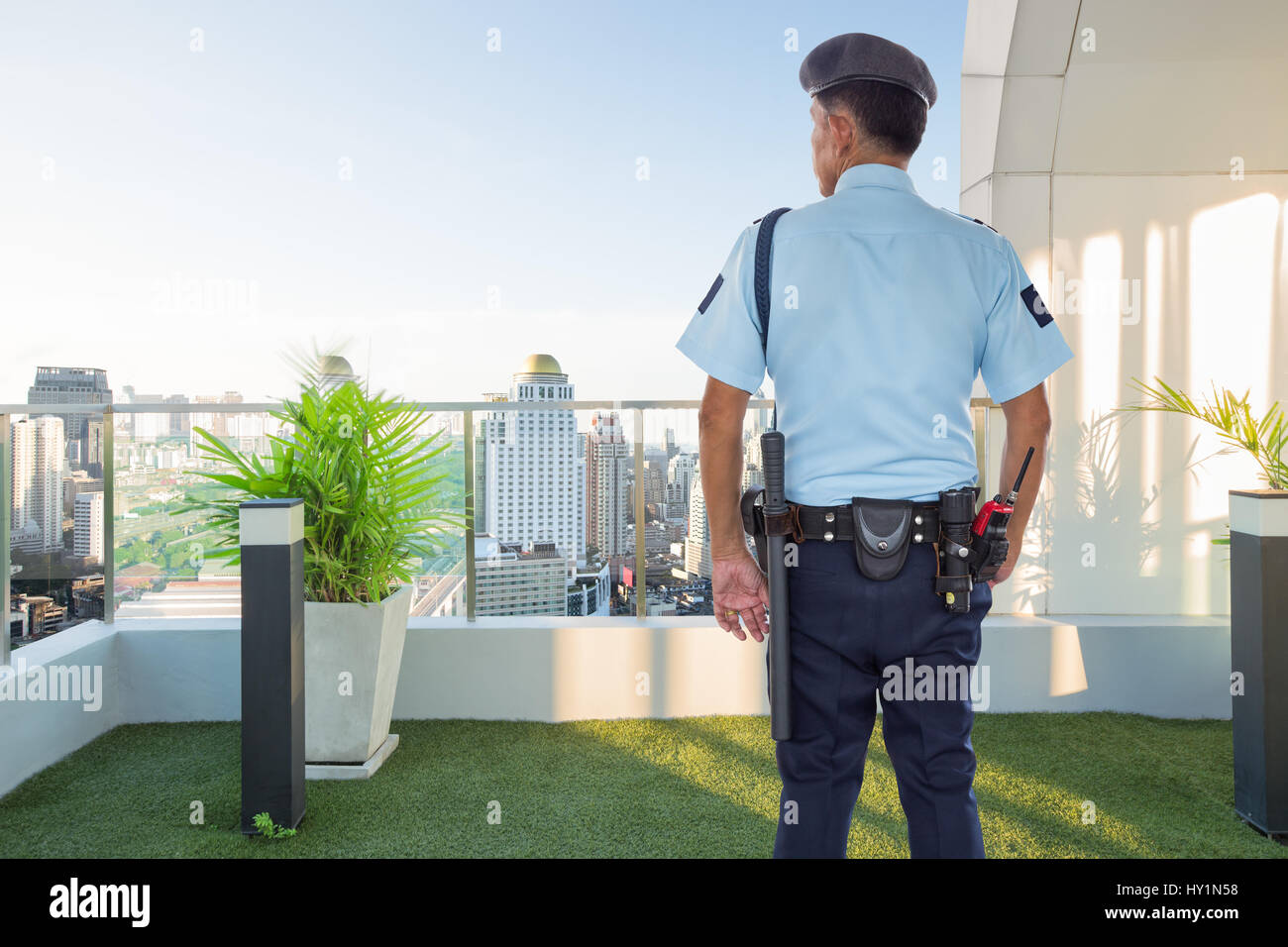 Security guard of condominium watching surveillance Stock Photo - Alamy