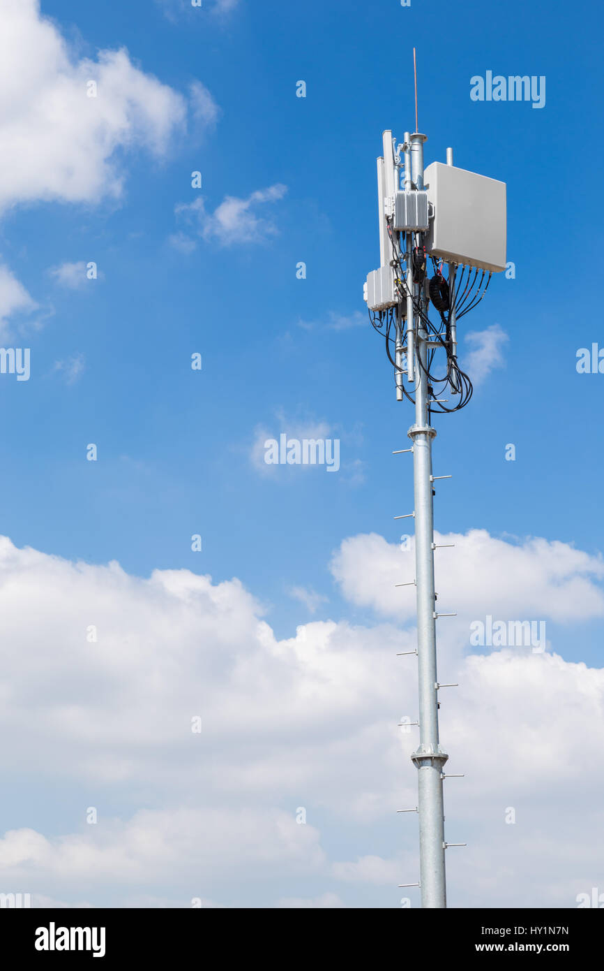Antenna repeater tower on blue sky Stock Photo - Alamy