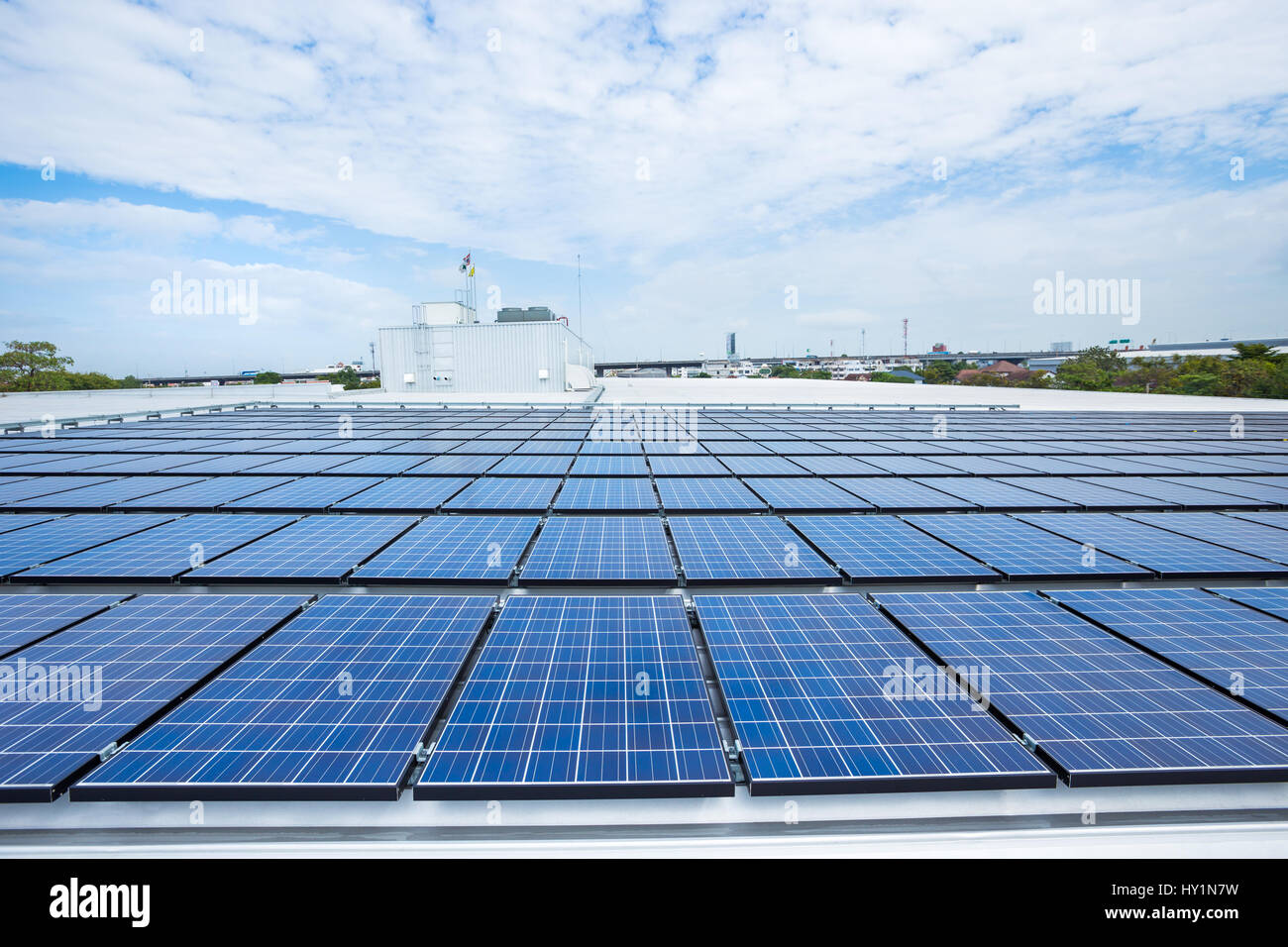 Solar panels on factory roof Stock Photo - Alamy