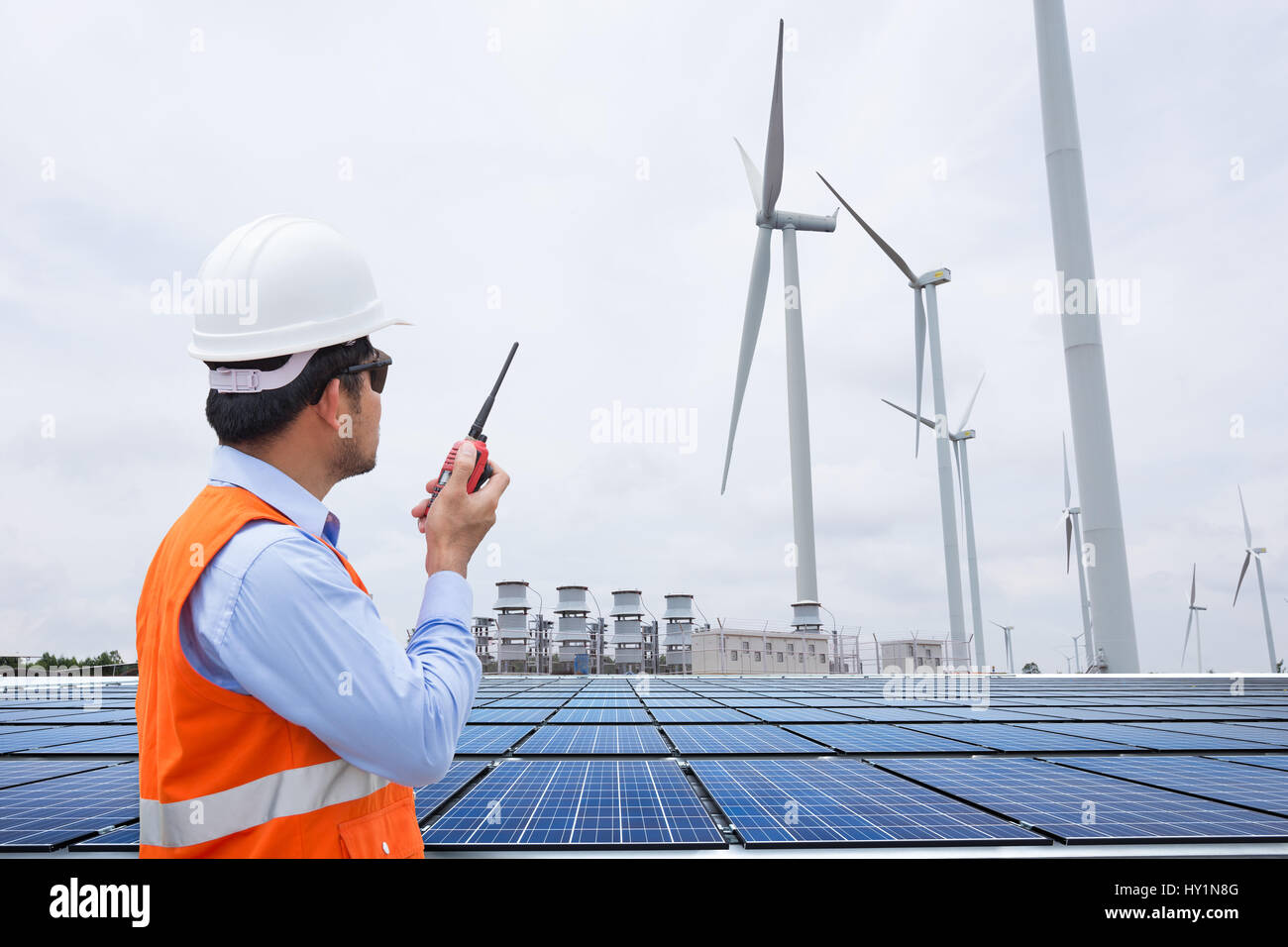 Electrical engineers working at wind turbine power generator station ...