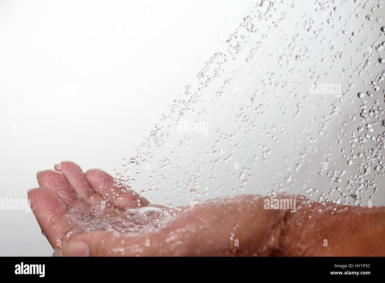 Human hand and faling water Stock Photo - Alamy