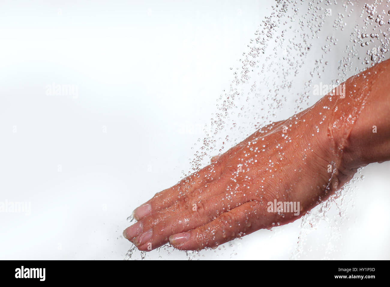 Human hand and faling water Stock Photo - Alamy