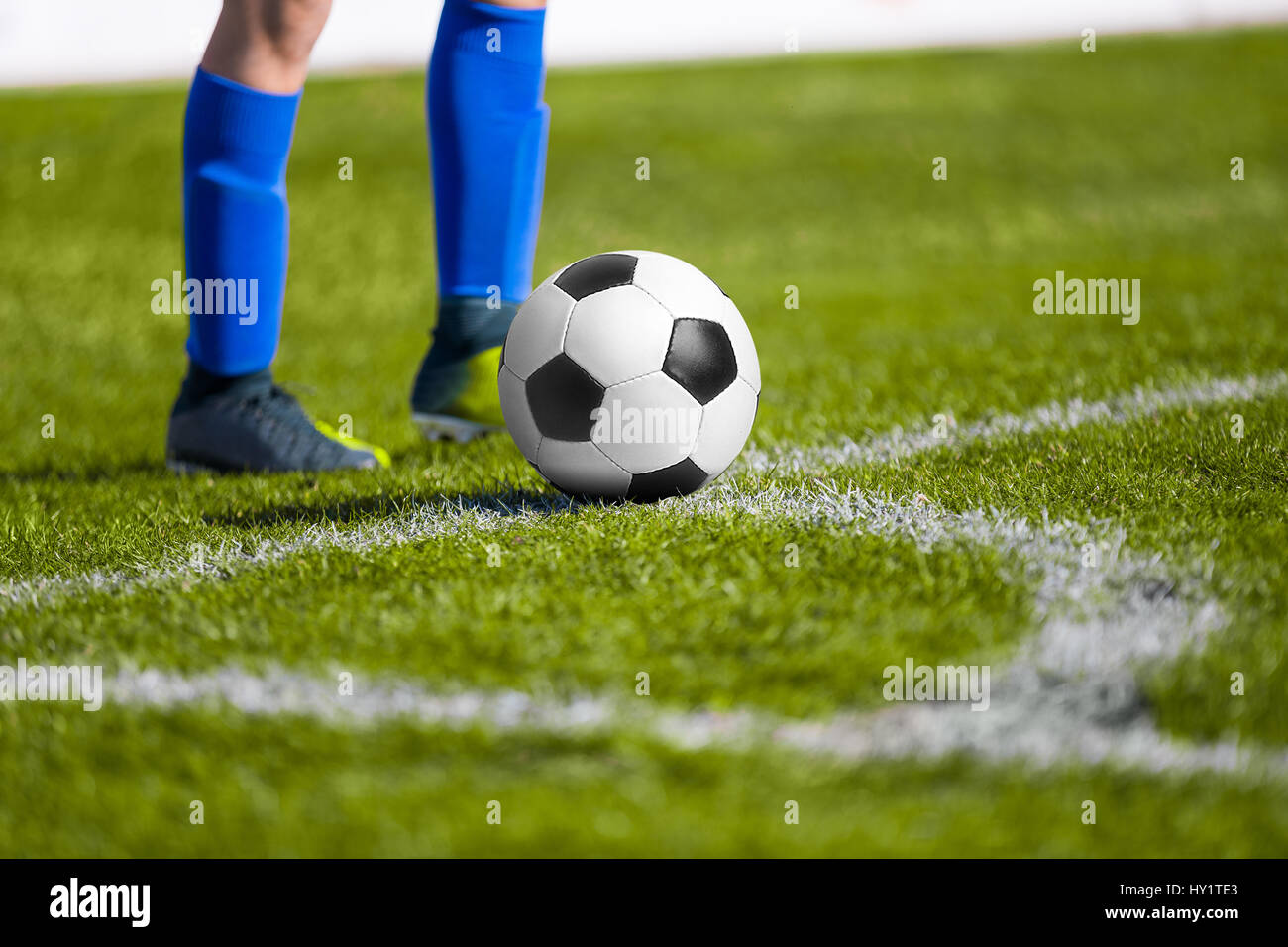Soccer ball on the field - shooting a corner Stock Photo - Alamy