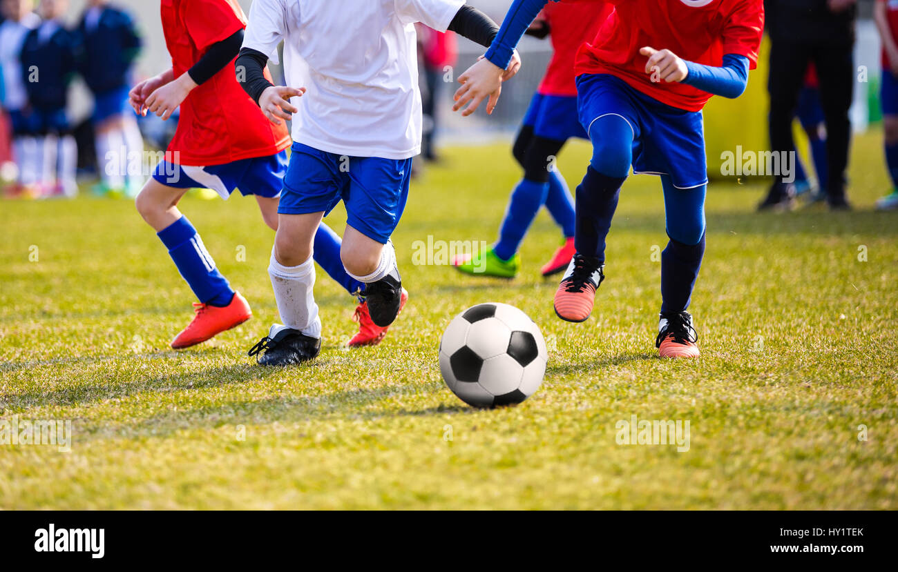 Training and football match between youth soccer teams. Young boys ...