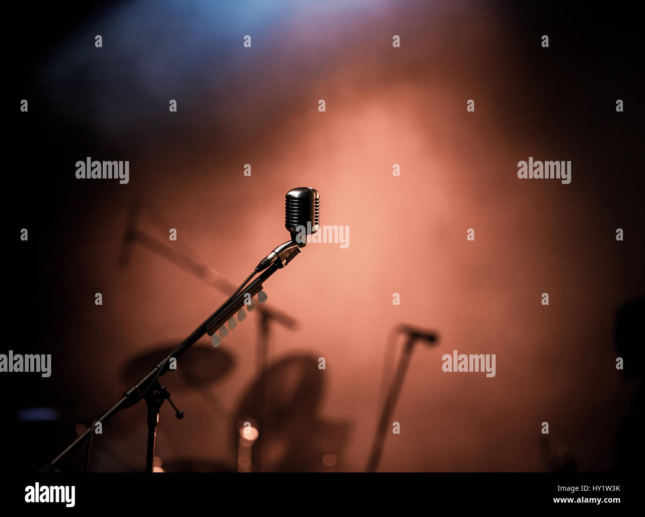 microphone in stage lights during concert Stock Photo - Alamy