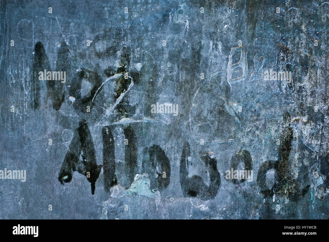 Not allowed written on a wall with a paint brush Stock Photo - Alamy