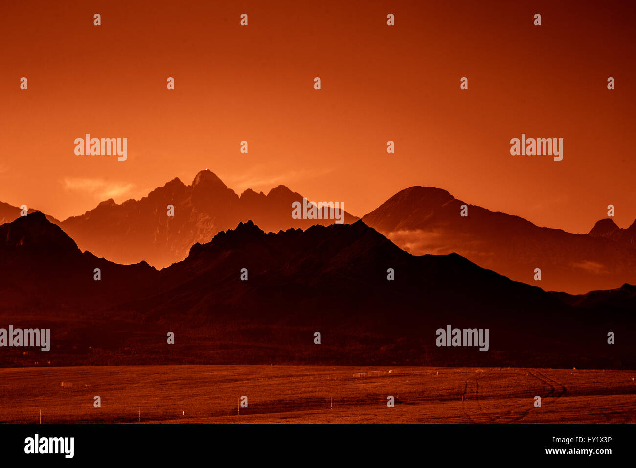 A beautiful, colorful, abstract mountain landscape in a red tonality ...