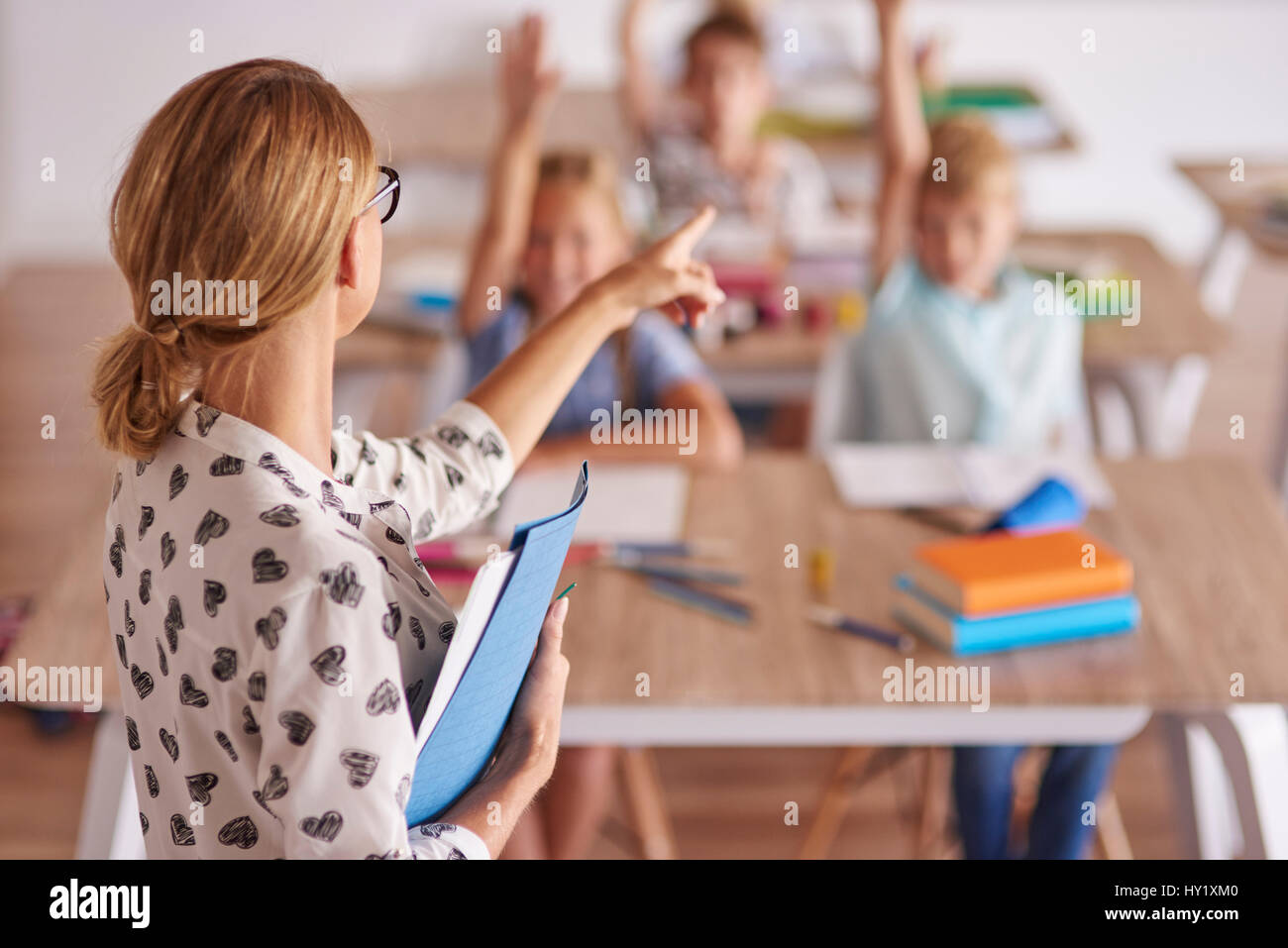 Teacher sitting with children hi-res stock photography and images - Alamy