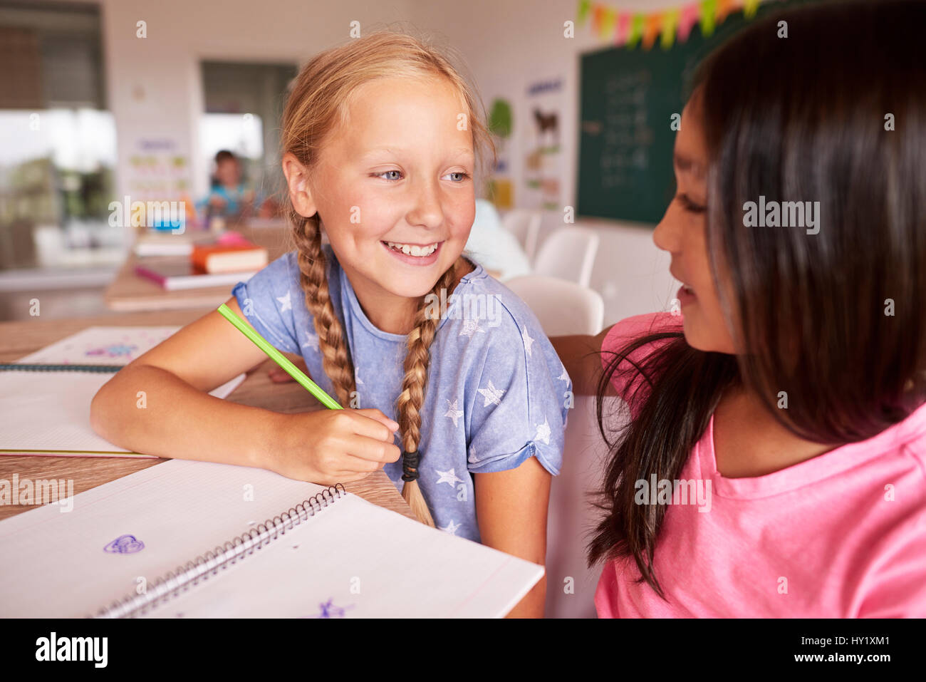 Two best friends in one desk Stock Photo - Alamy