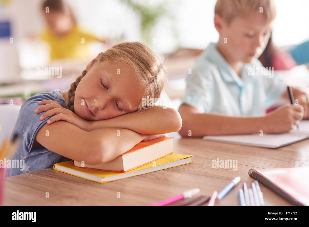 Girl sleeping during the lesson Stock Photo - Alamy