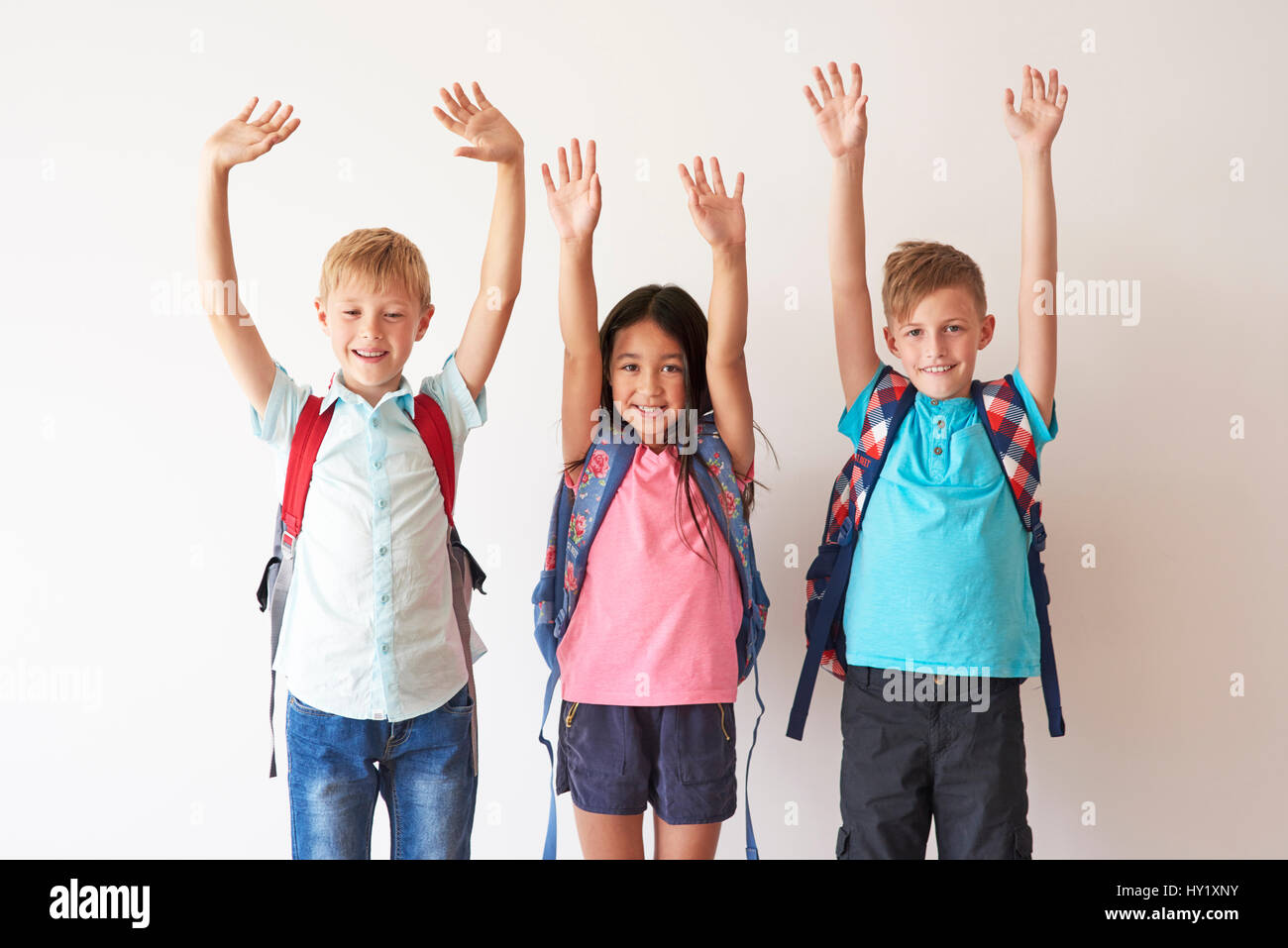Children hands raised indoors hi-res stock photography and images - Alamy